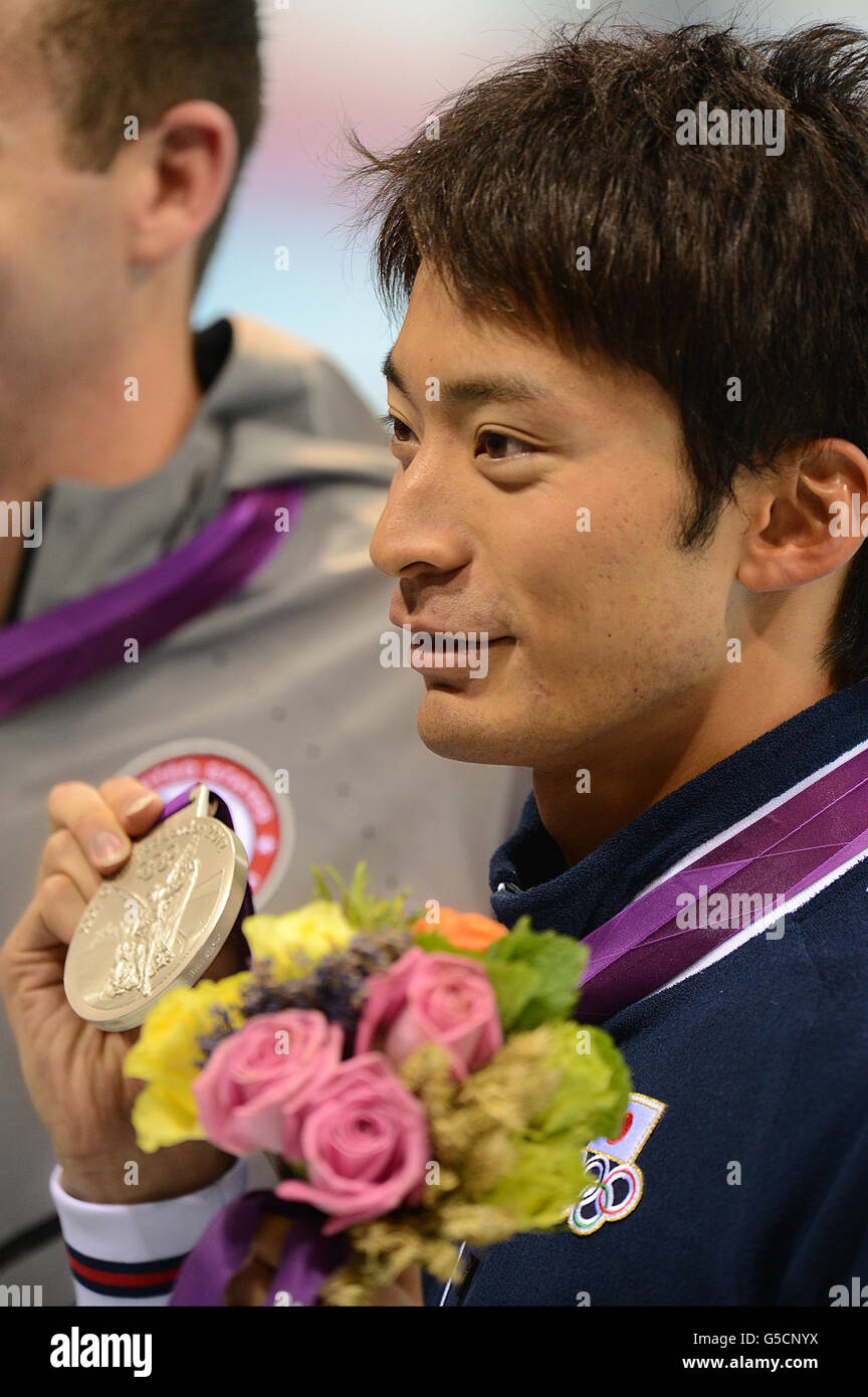 Silver Medalist Ryosuke Irie celebrates with his medal after the Men's ...