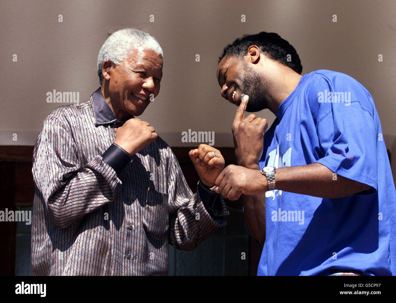 Lennox lewis meets nelson mandela hi-res stock photography and images ...