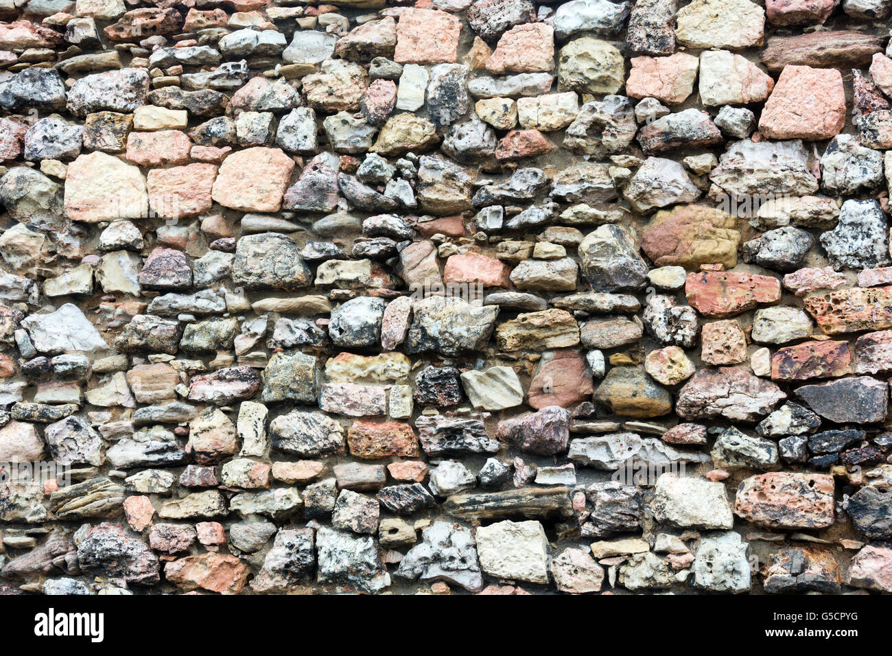 Stony wall from big cobblestones close up, background Stock Photo - Alamy
