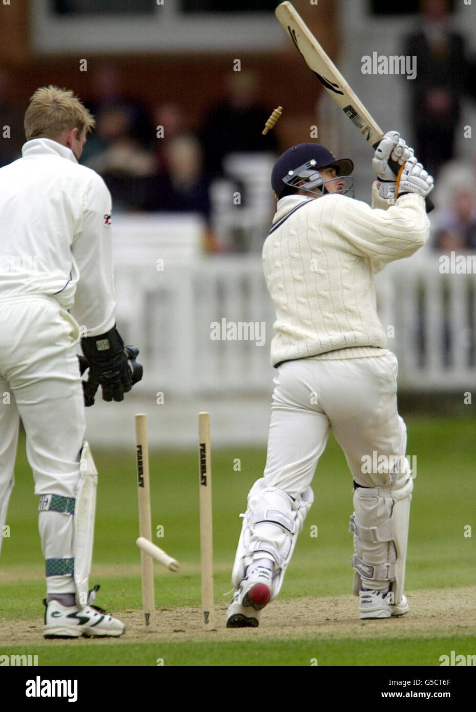 Middlesex batsman Paul Weekes is bowled, watched by Hampshire wicket ...