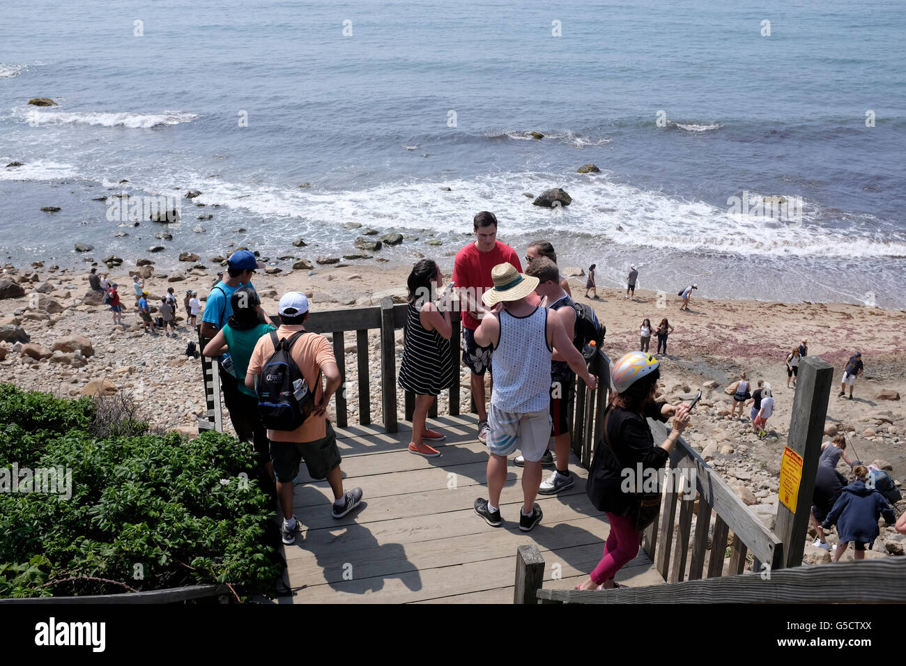Tourists at the beach near Mohegan's Bluffs, Block Island, Rhode Island ...