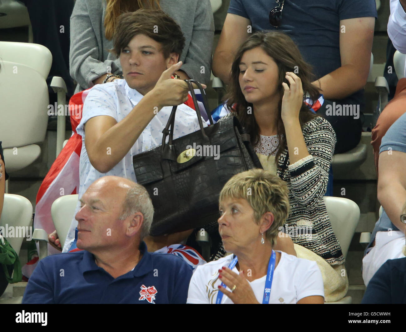 Louis Tomlinson from the band One Direction with partner Eleanor Calder ...