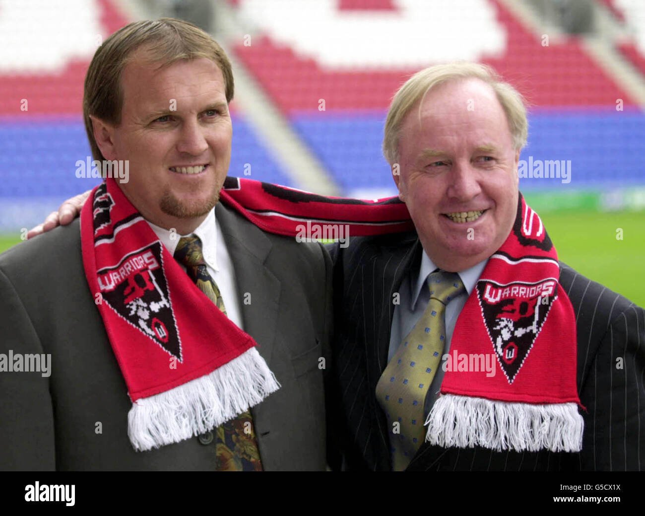 Wigan's new coach Stuart Raper (left) poses for photographers with ...