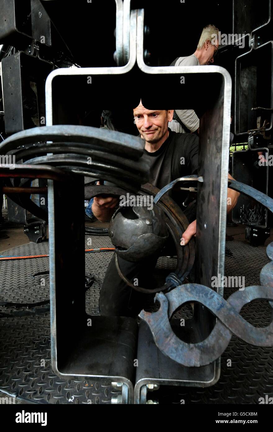 One of 75 blacksmiths working on a new sculpture, taking inspiration ...