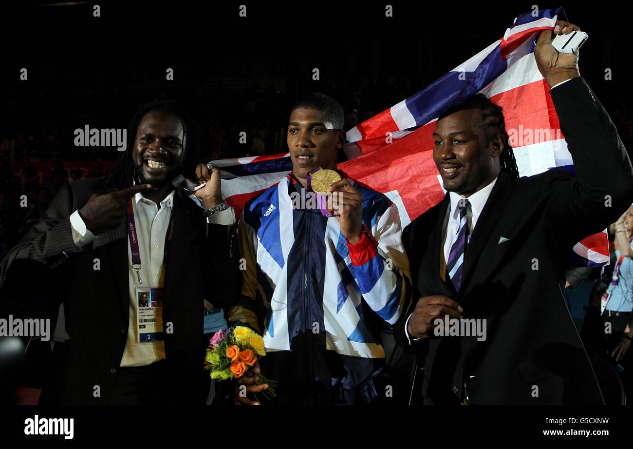 Great Britain's Anthony Joshua (centre) celebrates winning gold with ...
