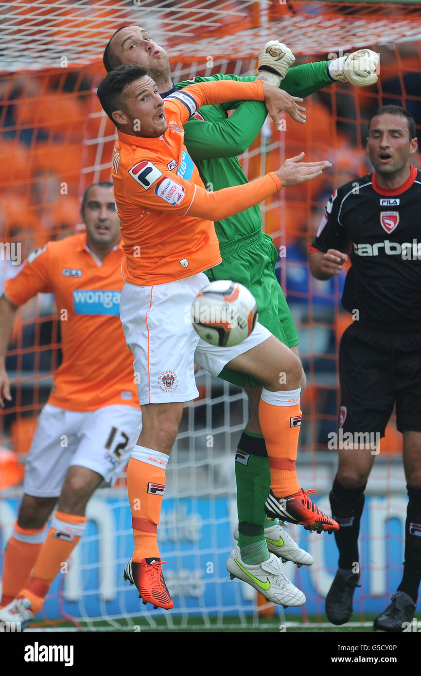 Blackpool's Barry Ferguson and Morecambe's Barry Roche battle for the ...
