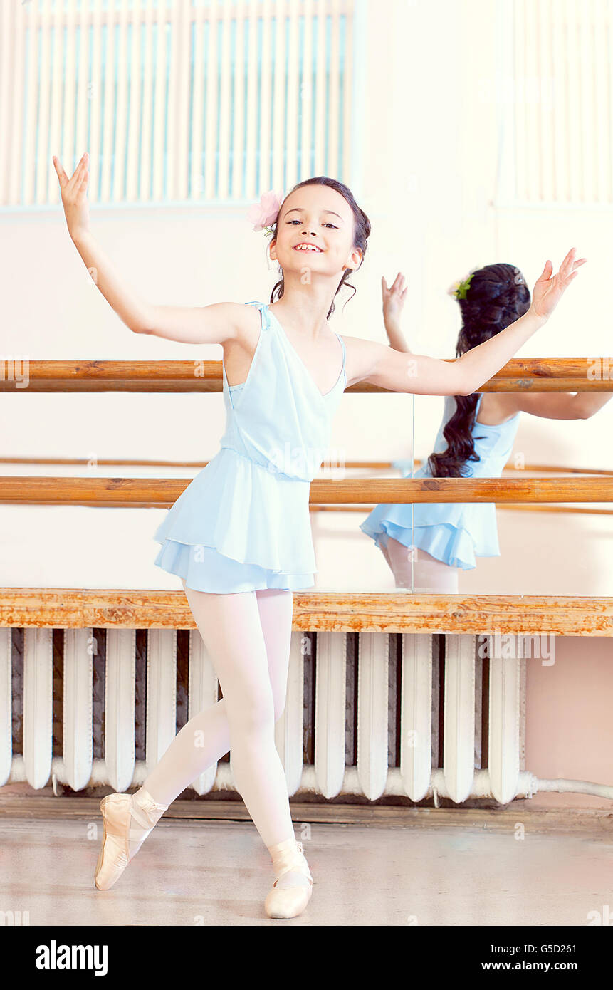 Artistic girl posing at camera in ballet class Stock Photo - Alamy