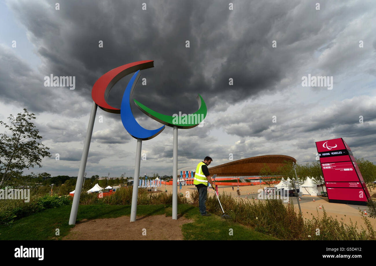 Adam Hoban from the Grounds Maintenance team rakes grass beside ...