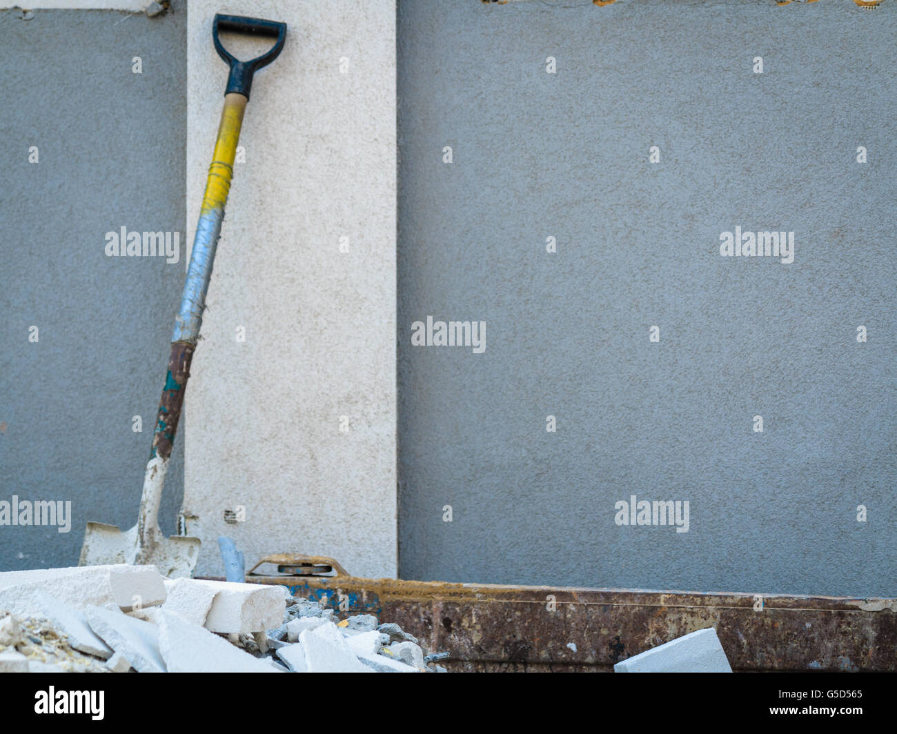 Trash construction building demolition waste hard work concept. Spade ...