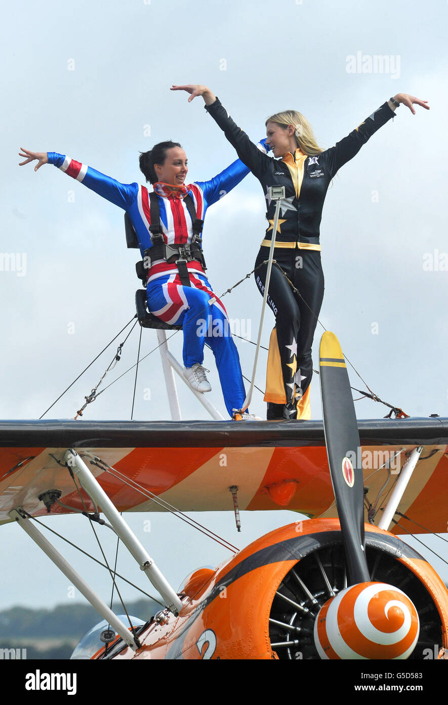 Olympics Bronze medalist Beth Tweddle (left) is instructed by Freya ...