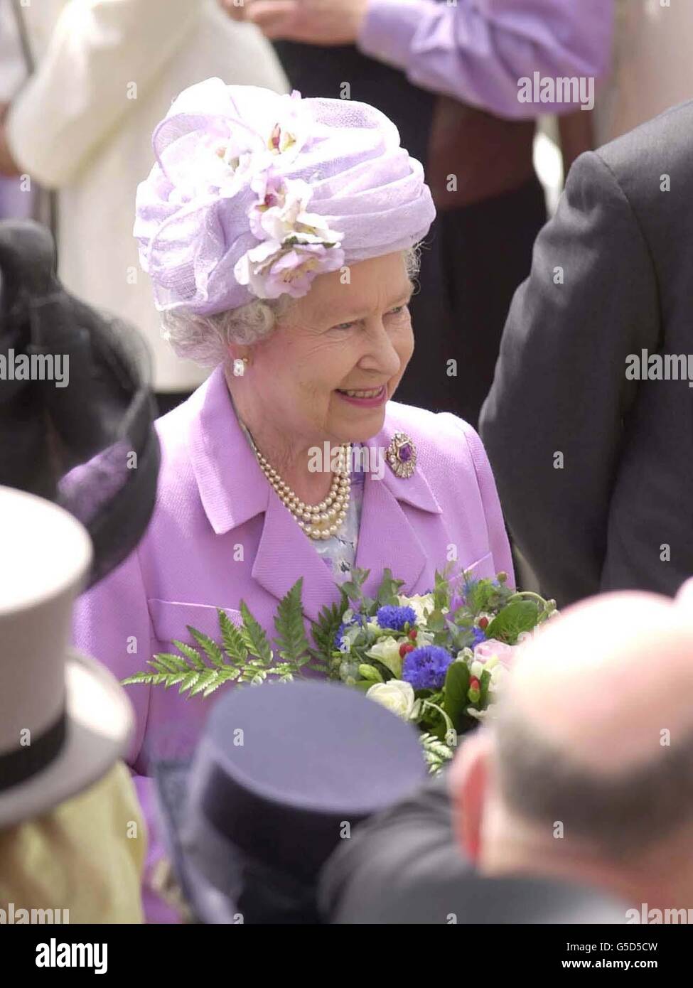 Queen Elizabeth II walks through the crowds to the Royal Box on ...
