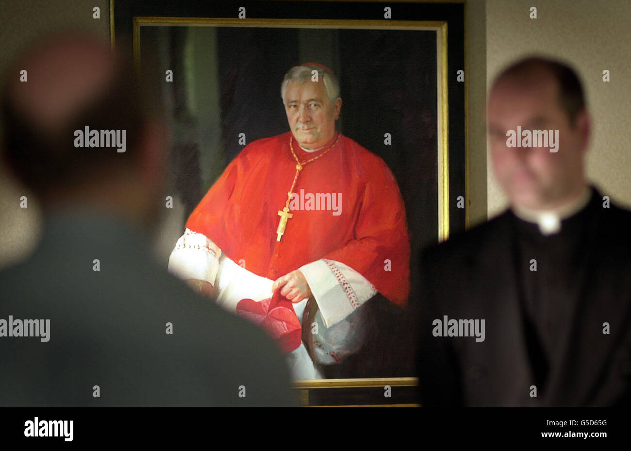 Chancellor of the Diocese Peter Smith (right) gives his reaction to the ...