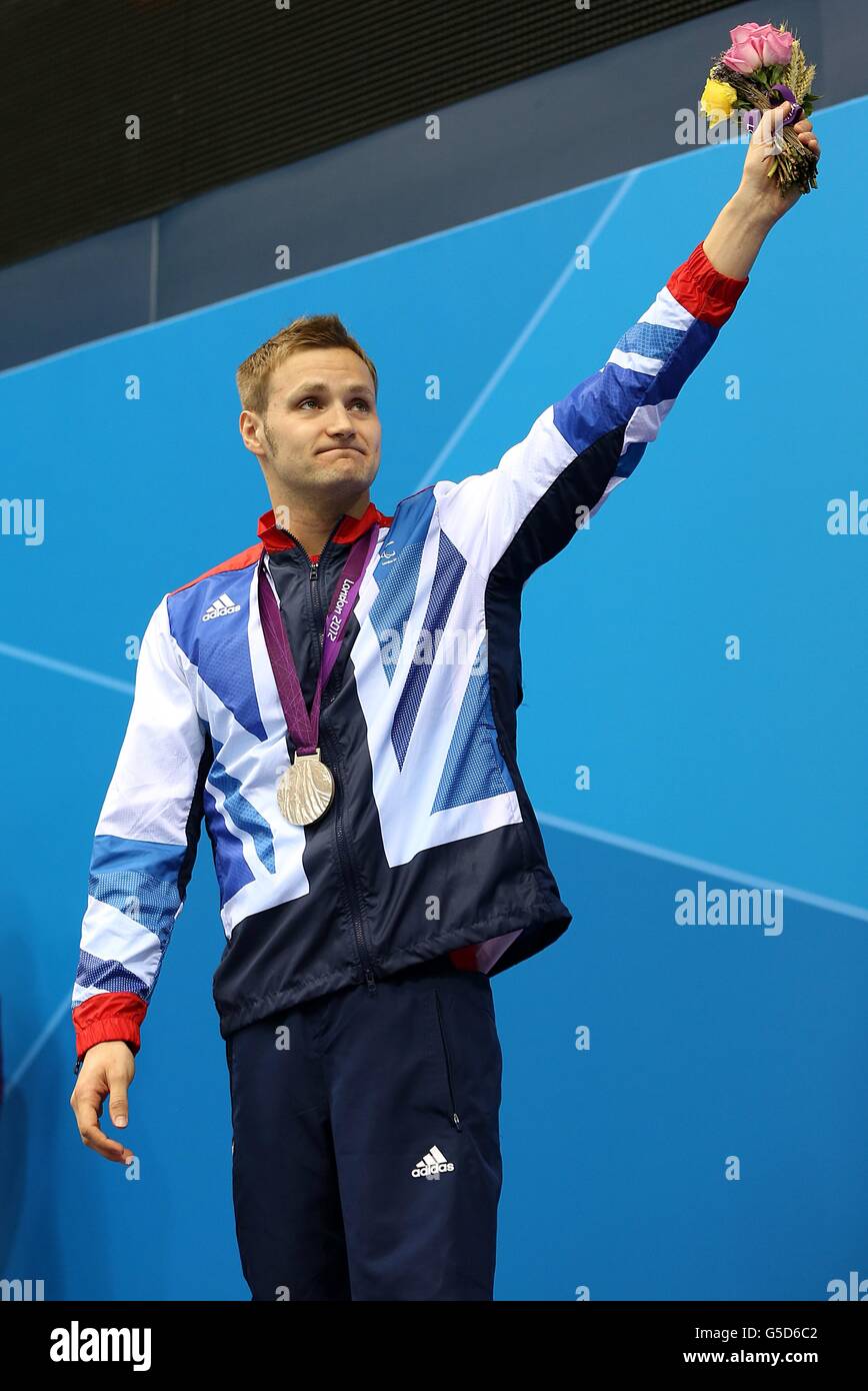 Great Britain's James Crisp receives his silver medal following the Men ...