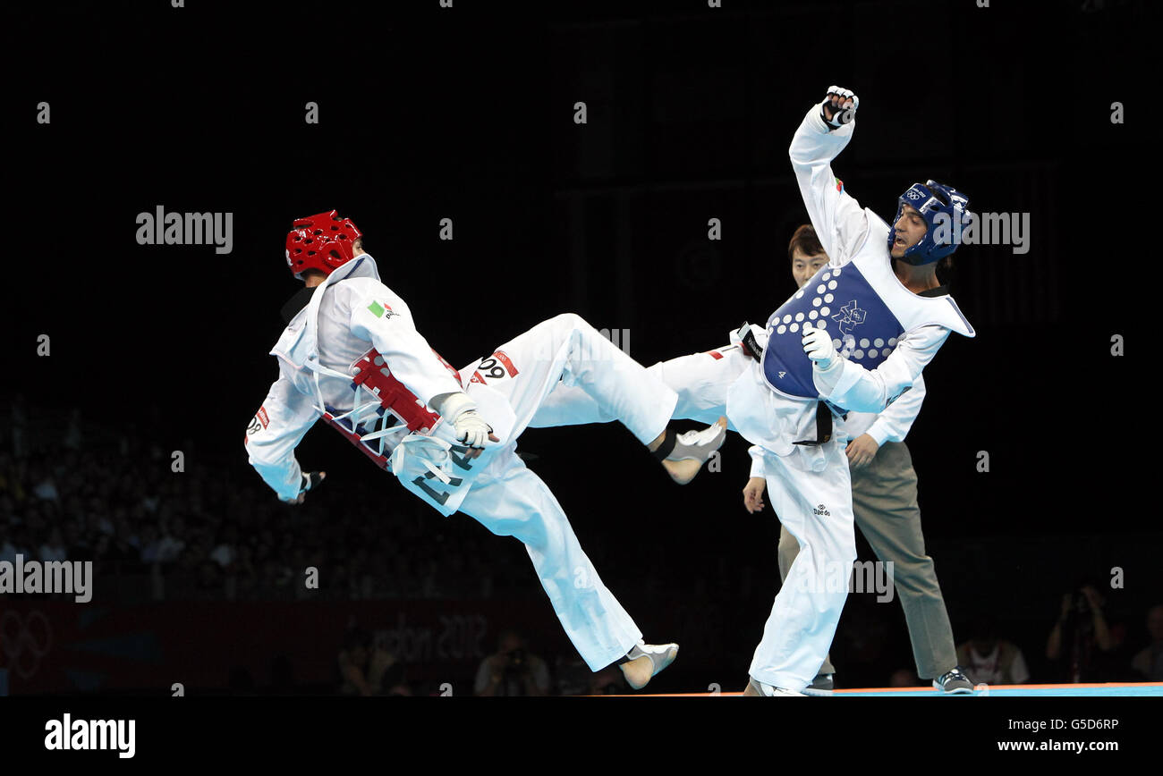 Italy's Mauro Sarmiento (L) competes against Azerbaijan's Ramin Azizov ...