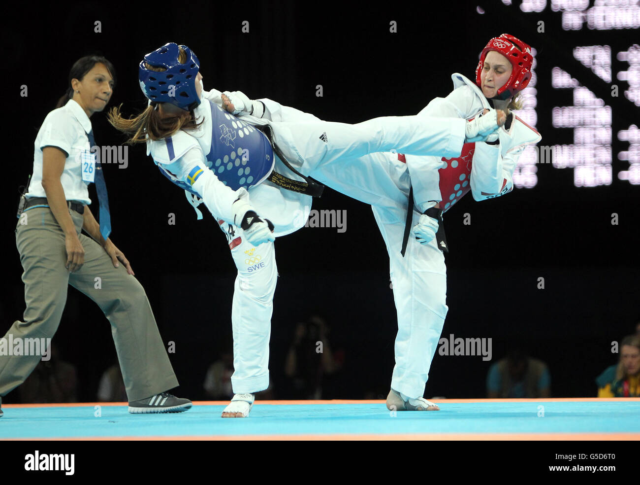 Sweden's Elin Johansson (L) competes against Australia's Carmen Marton ...