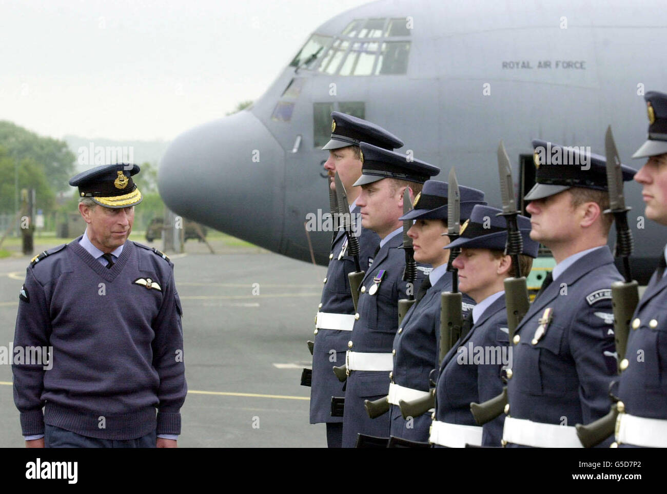 The Prince of Wales inspects the guard in front of a RAF Hercules ...