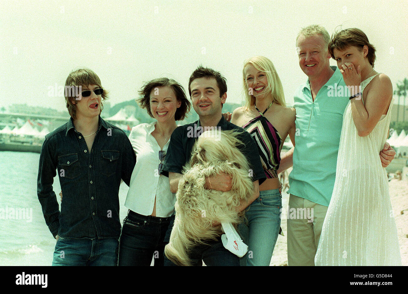 Luke de Woolfson, Melanie Gutteridge, Simon Lowe holding Leo the dog ...