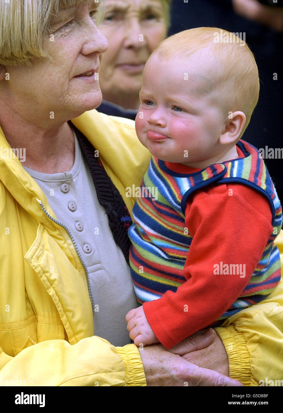 Seven-month old Coll MacAskill from Prestonpans leaves in the arms of ...