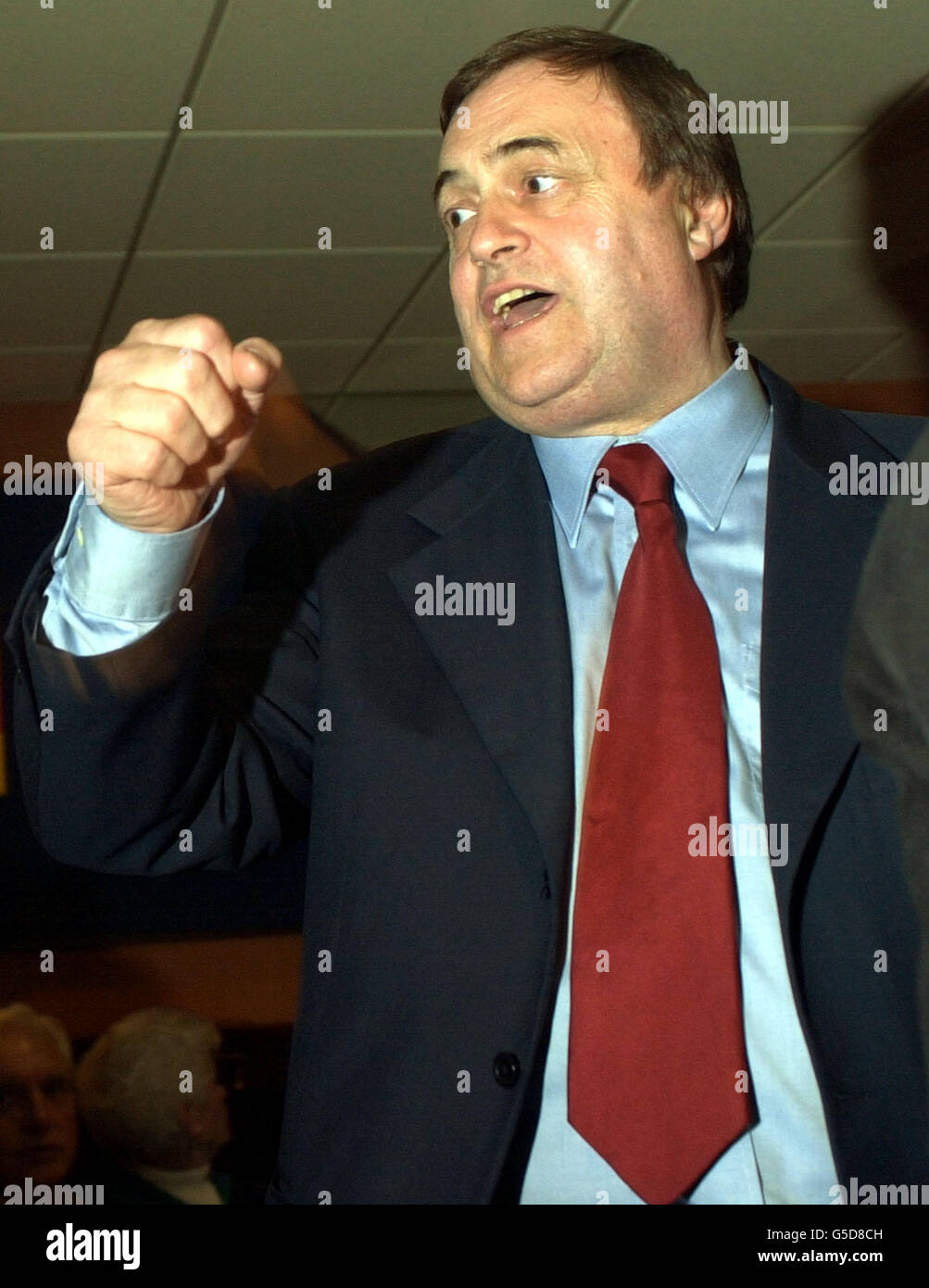 Deputy Prime Minister John Prescott raises his hand as he speaks to ...