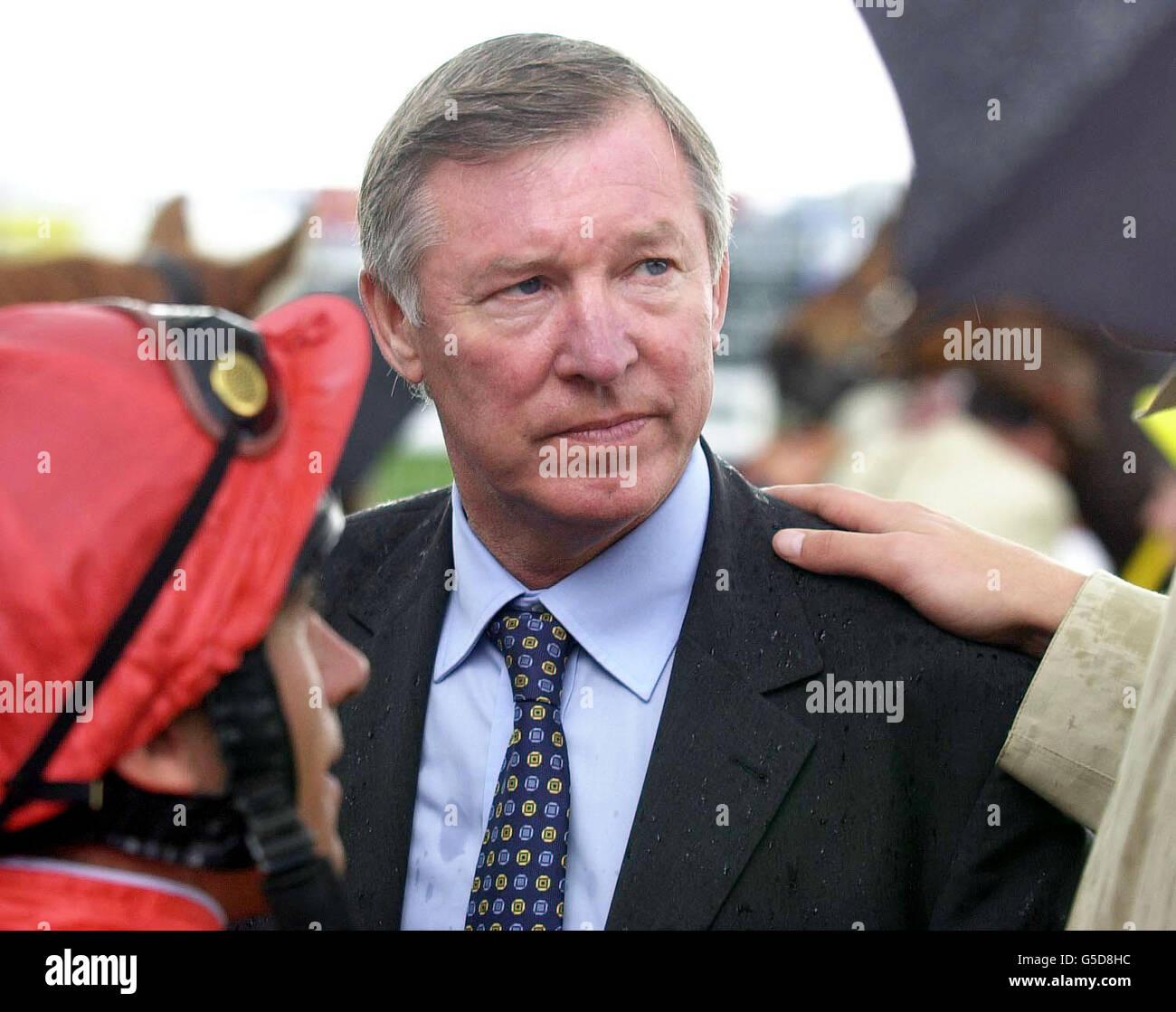 Consolation pat on the shoulder for Sir Alex Ferguson from his trainer ...