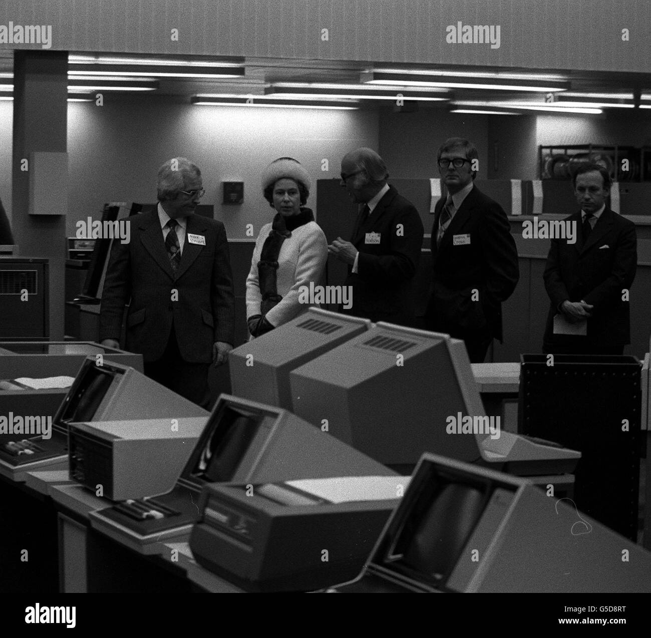 The Queen walking through the main computer hall of International ...