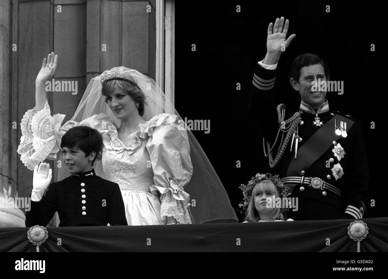 The Prince and the Princess of Wales waving to the crowds from ...