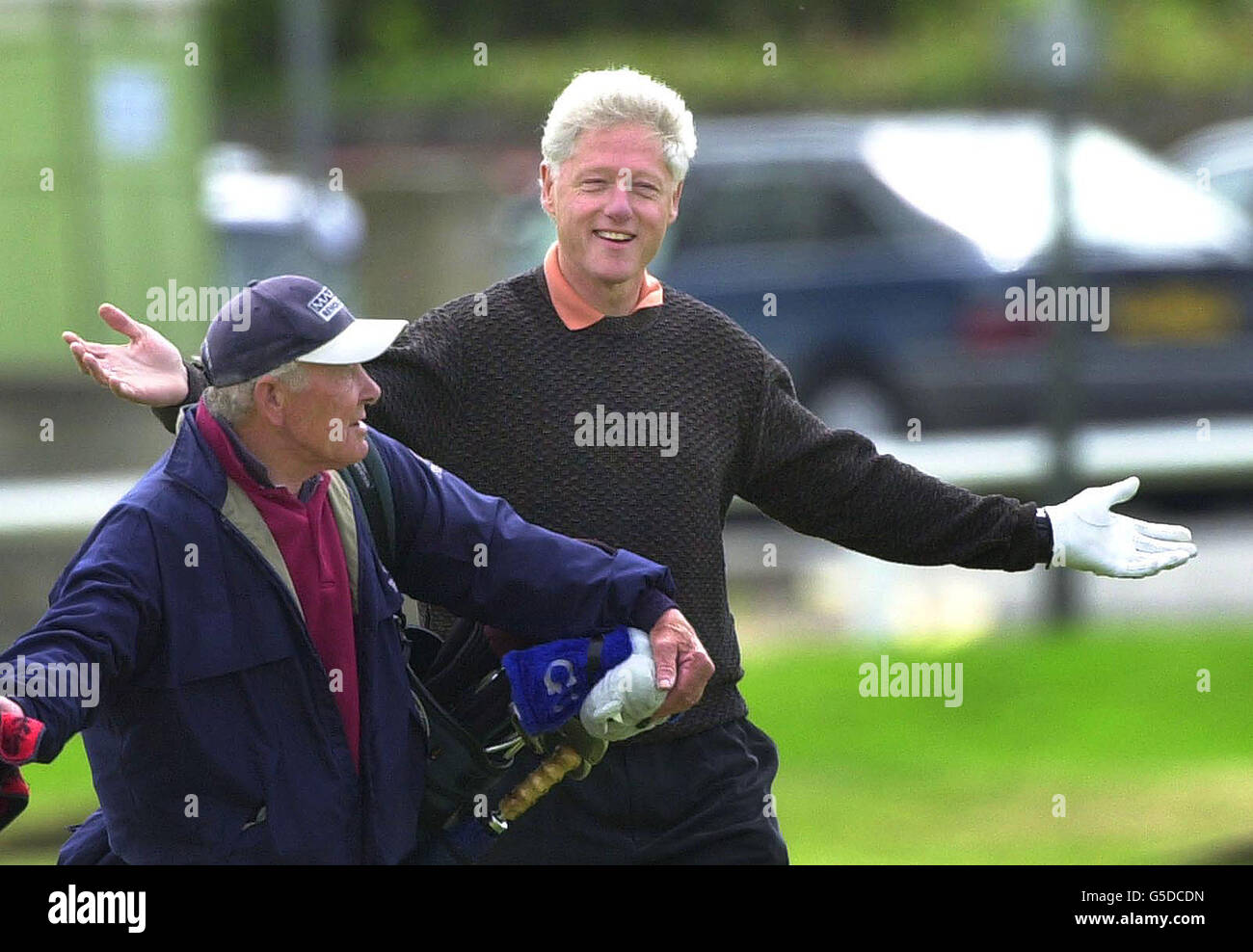 Former American President Bill Clinton waves to the crowds at the Old ...