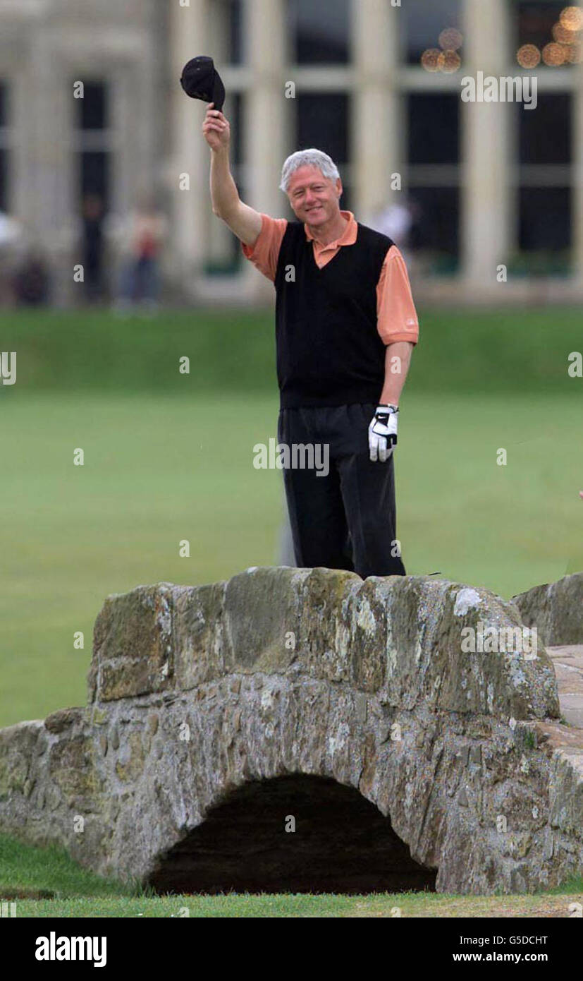 Former American President Bill Clinton stands on the Swilcan Bridge at ...