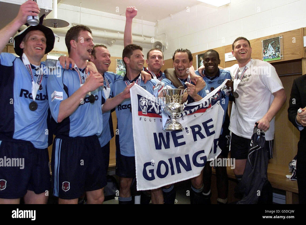 Bolton players celebrate in the dressing room after winning the ...