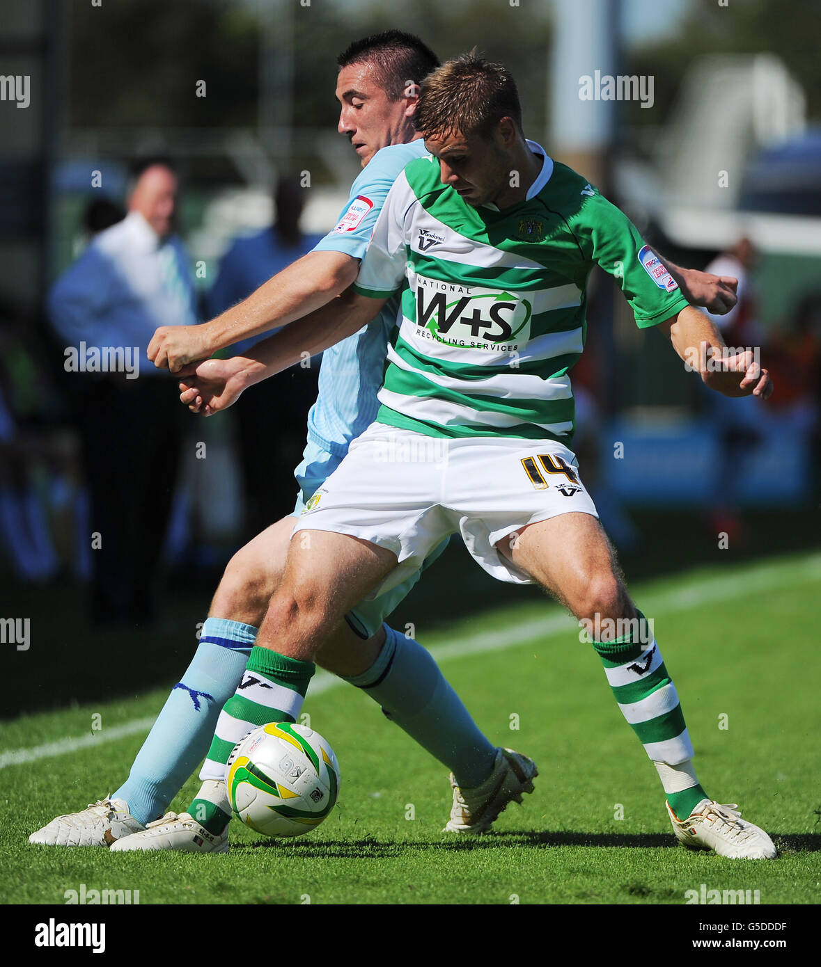 Coventry City's Callum Ball (left) and Yeovil Town's Sam Foley Stock ...