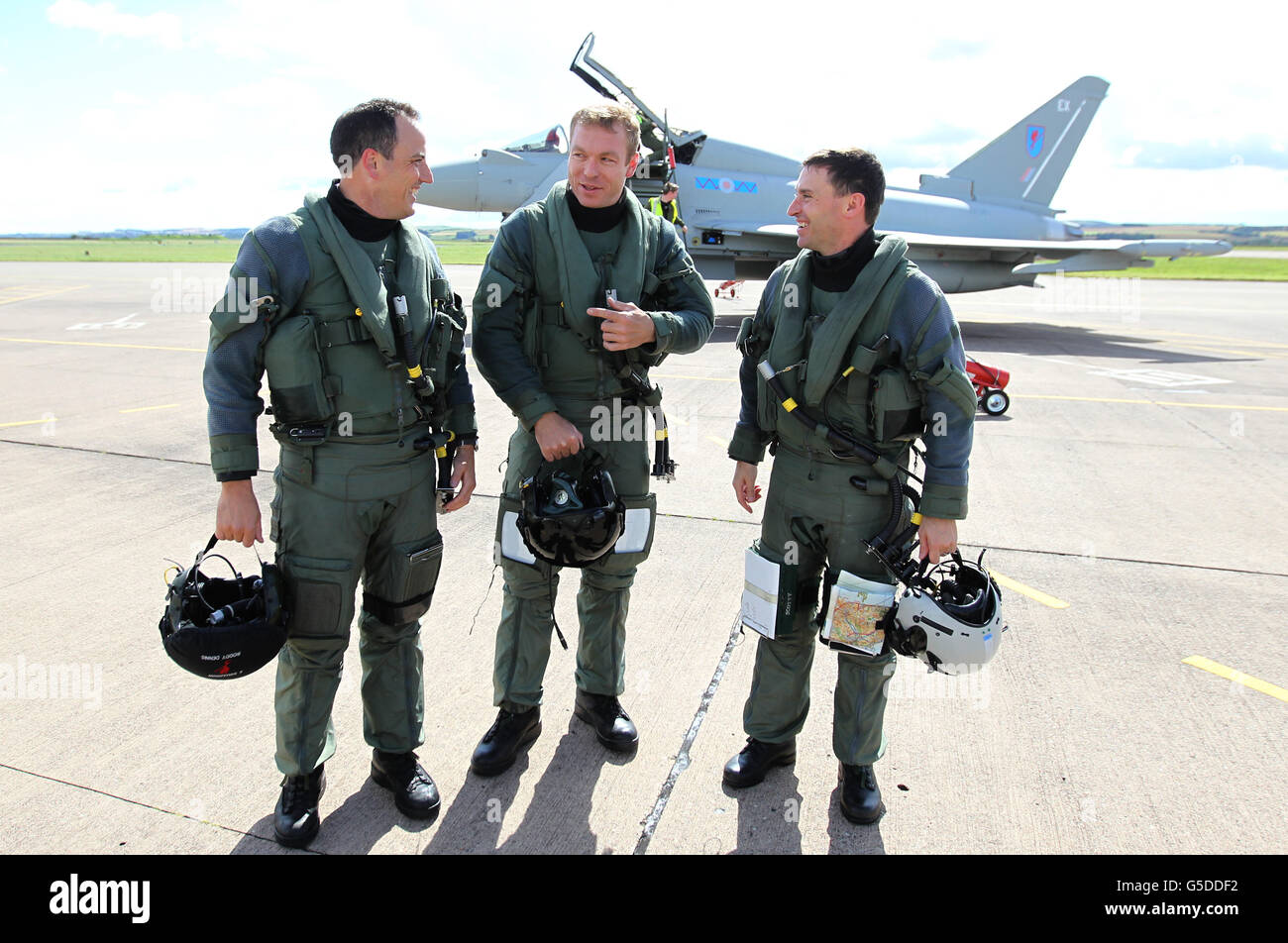 Sir Chris Hoy (centre) with pilot Wing Commander Roddy Dennis (left ...