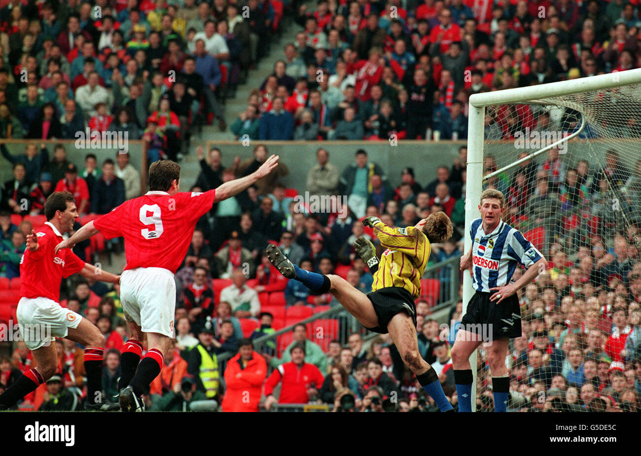 Chris Woods is beaten by this header from Steve Bruce to level the ...