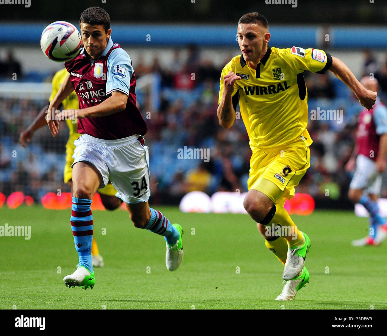 Aston Villa's Matthew Lowton and Tranmere's Jake Cassidy during the ...