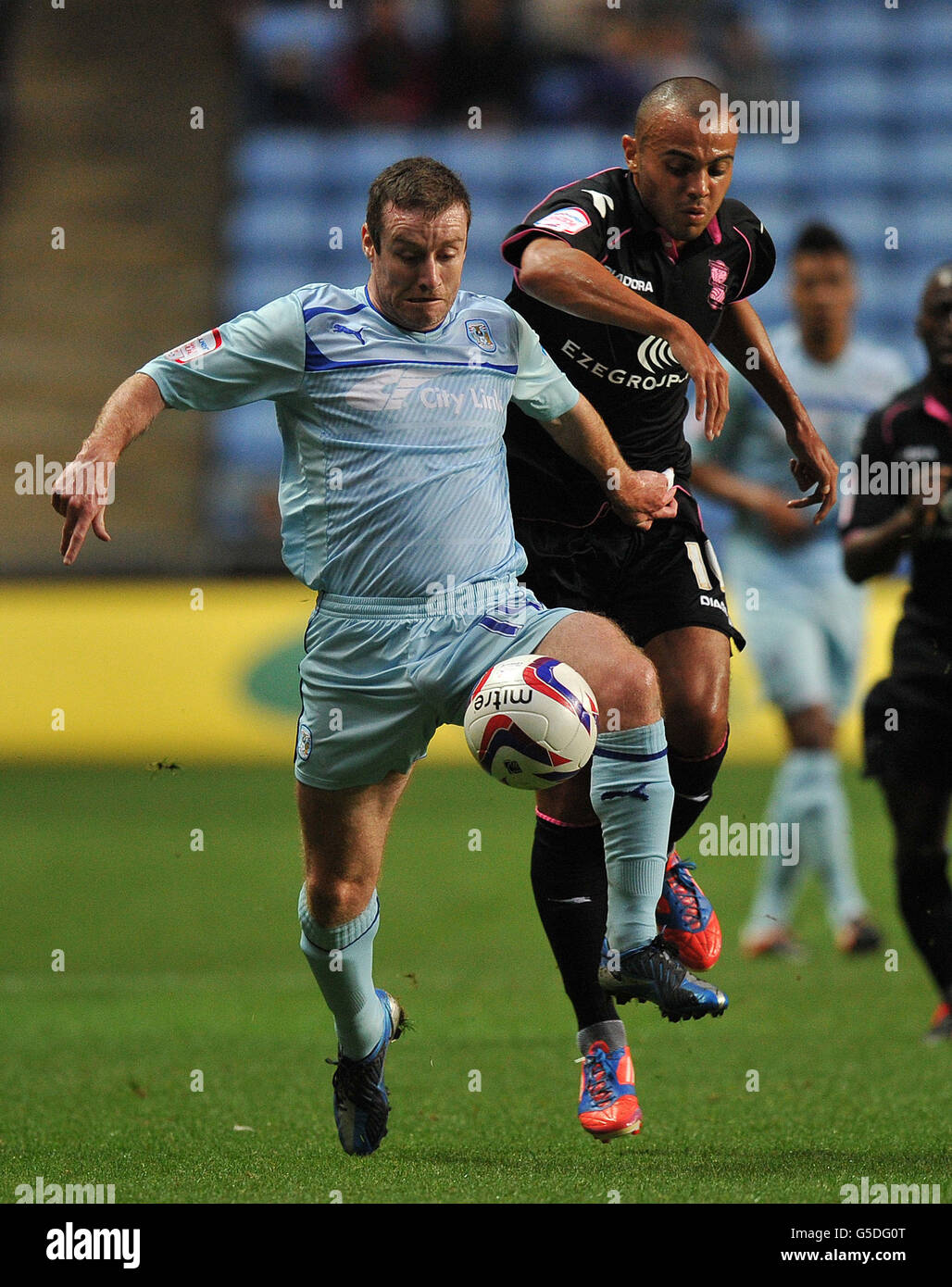 Coventry City's Stephen Elliott and Birmingham City's Ben Gordon battle ...