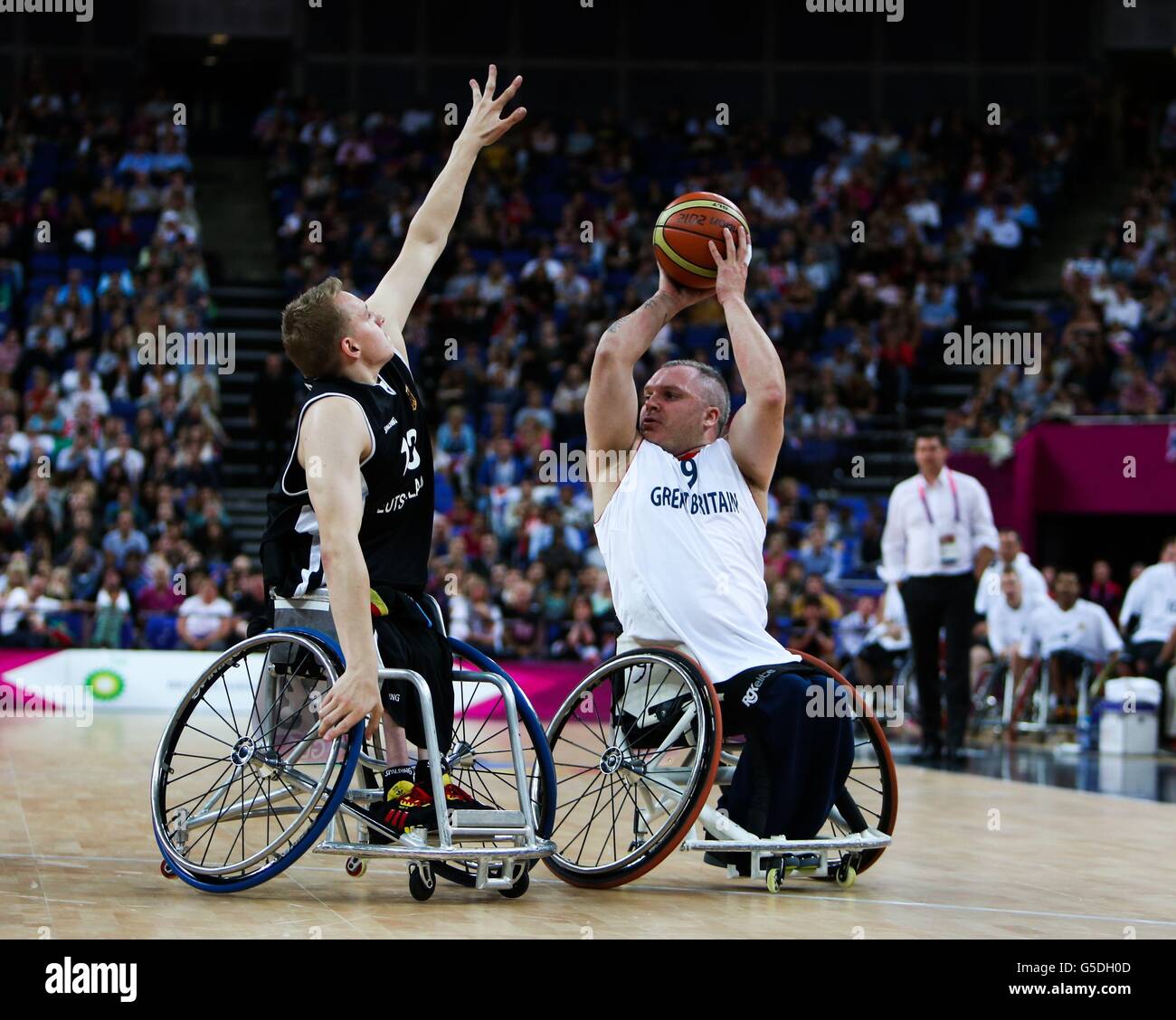 Great Britain's Joni Pollock has his shot blocked by Germany's Jan ...