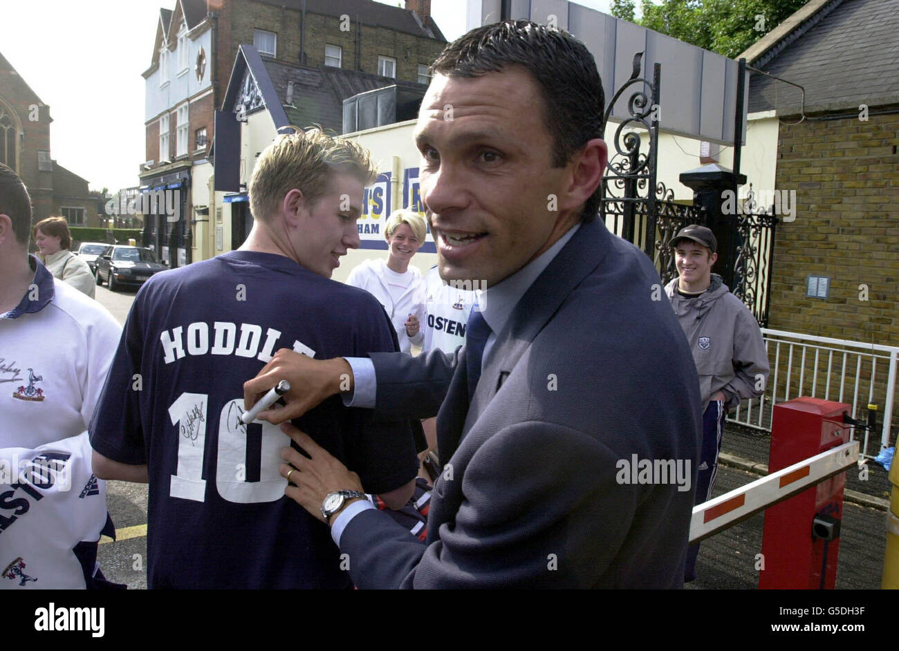 The new Tottenham Hotspur signing Gustavo Poyet holds up his new ...