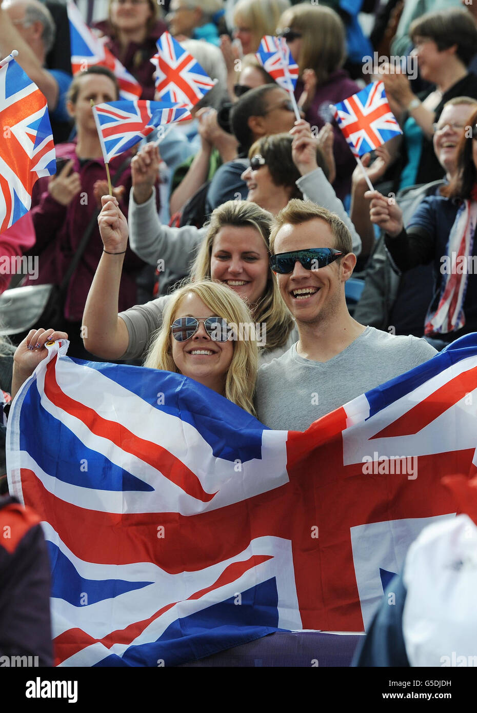 Members of the crowd cheer on the Great Britain riders in the Dressage ...