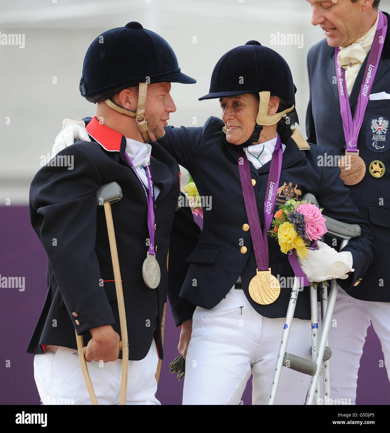 Great Britain's Lee Pearson with his silver medal and Australia's Joann ...