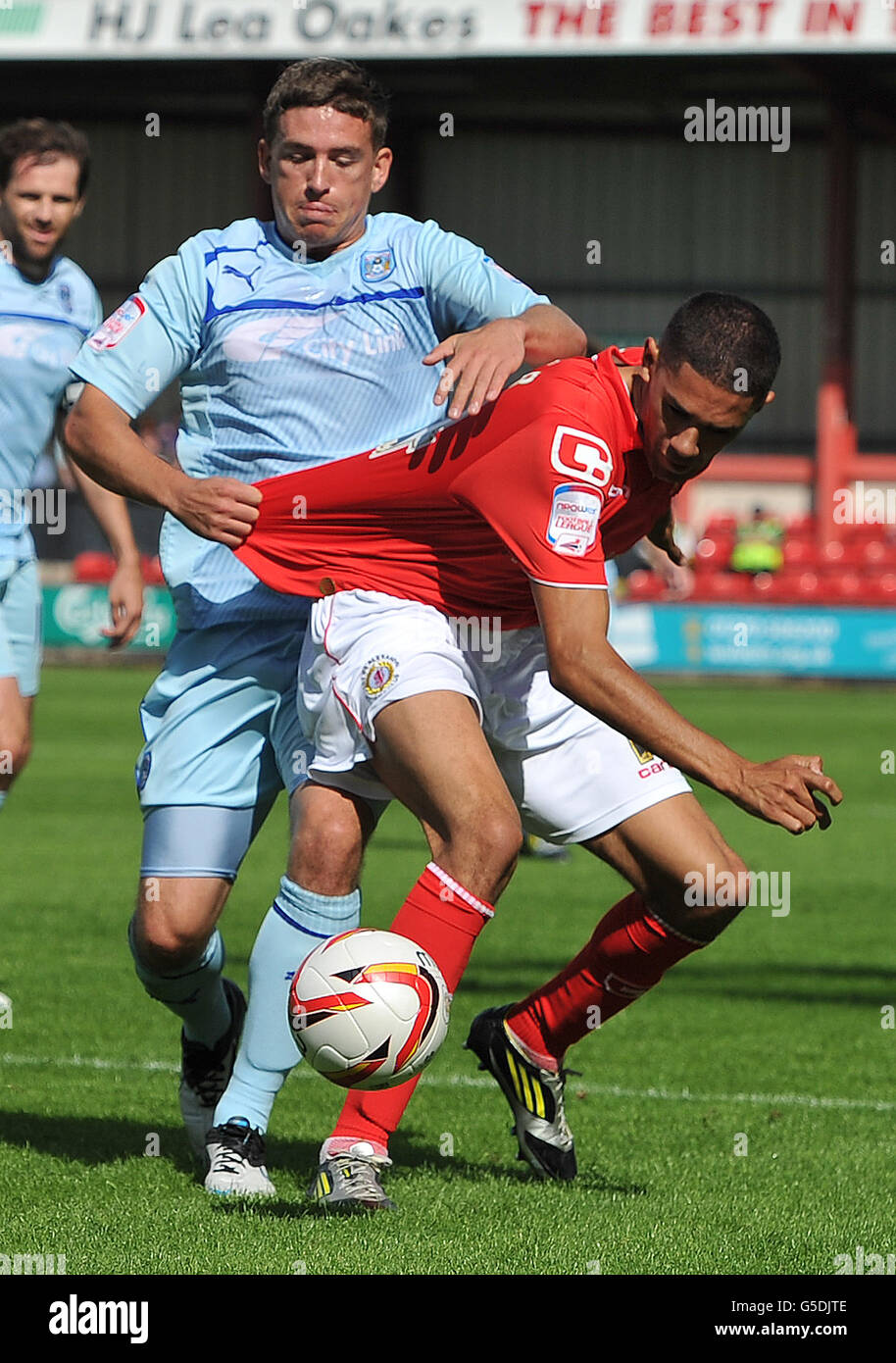 Coventry City's Carl Baker and Crew Alexandra's Kelvin Mellor battle ...