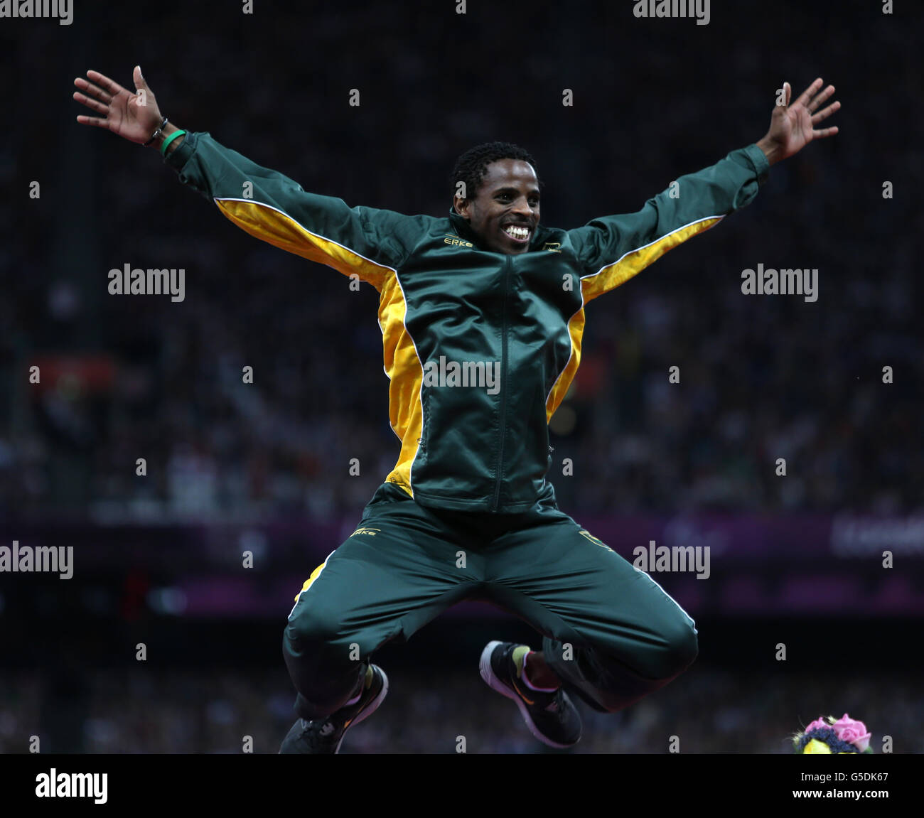South Africa's Jonathan Ntutu jumps up to receive his Bronze medal in ...