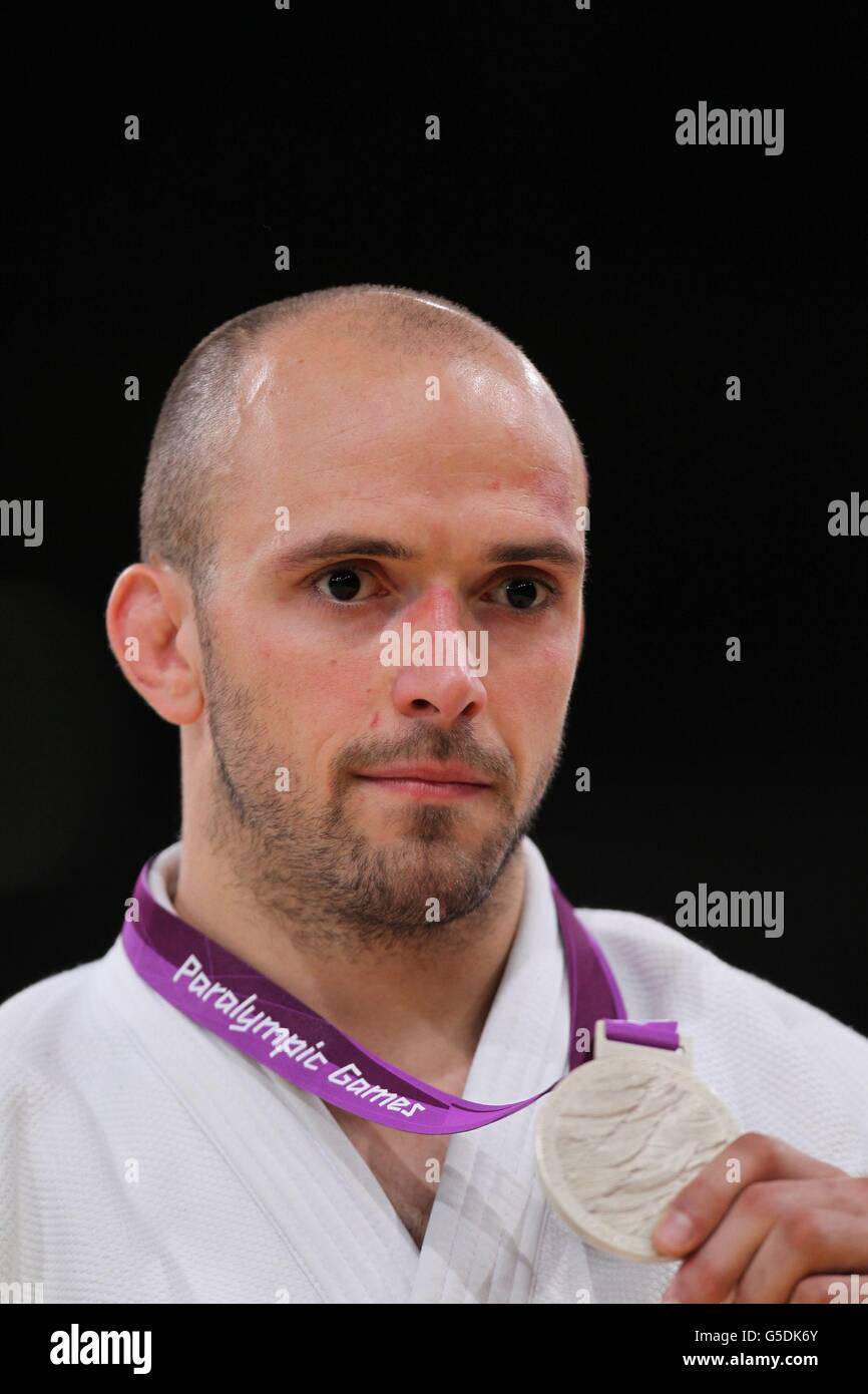 Great Britain's Samuel Ingram holds his silver medal after competing in ...