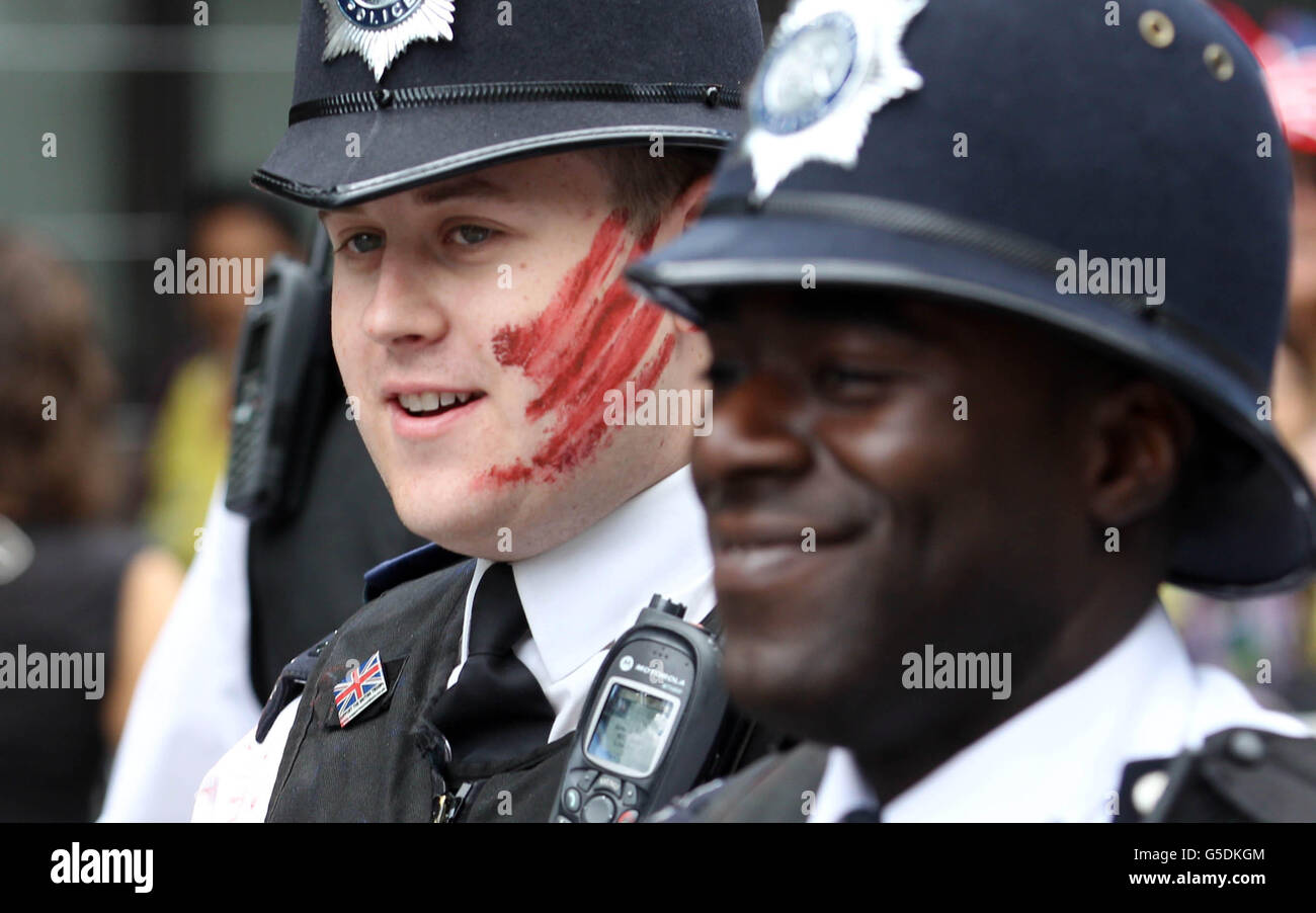A policeman with paint on his face at the Notting Hill Carnival in west ...