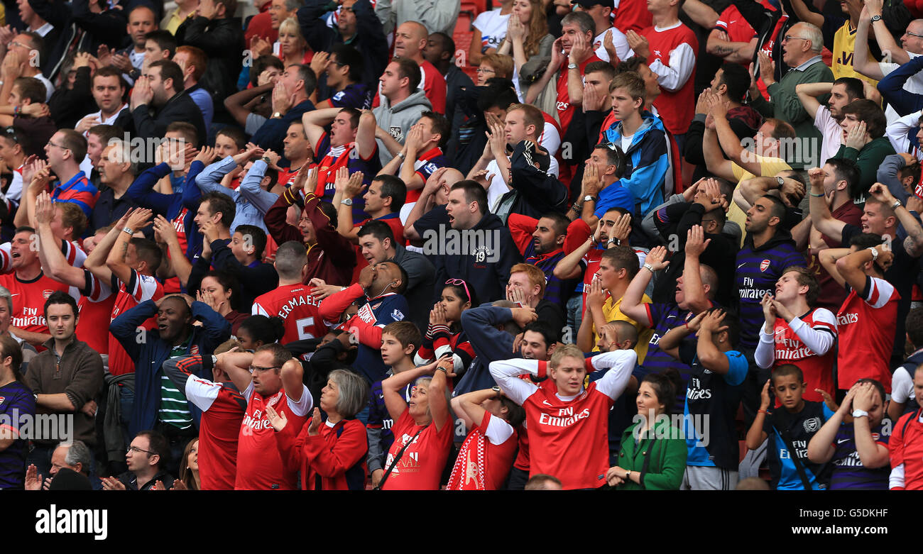 Arsenal fans hold their heads in their hands after a near miss Stock ...