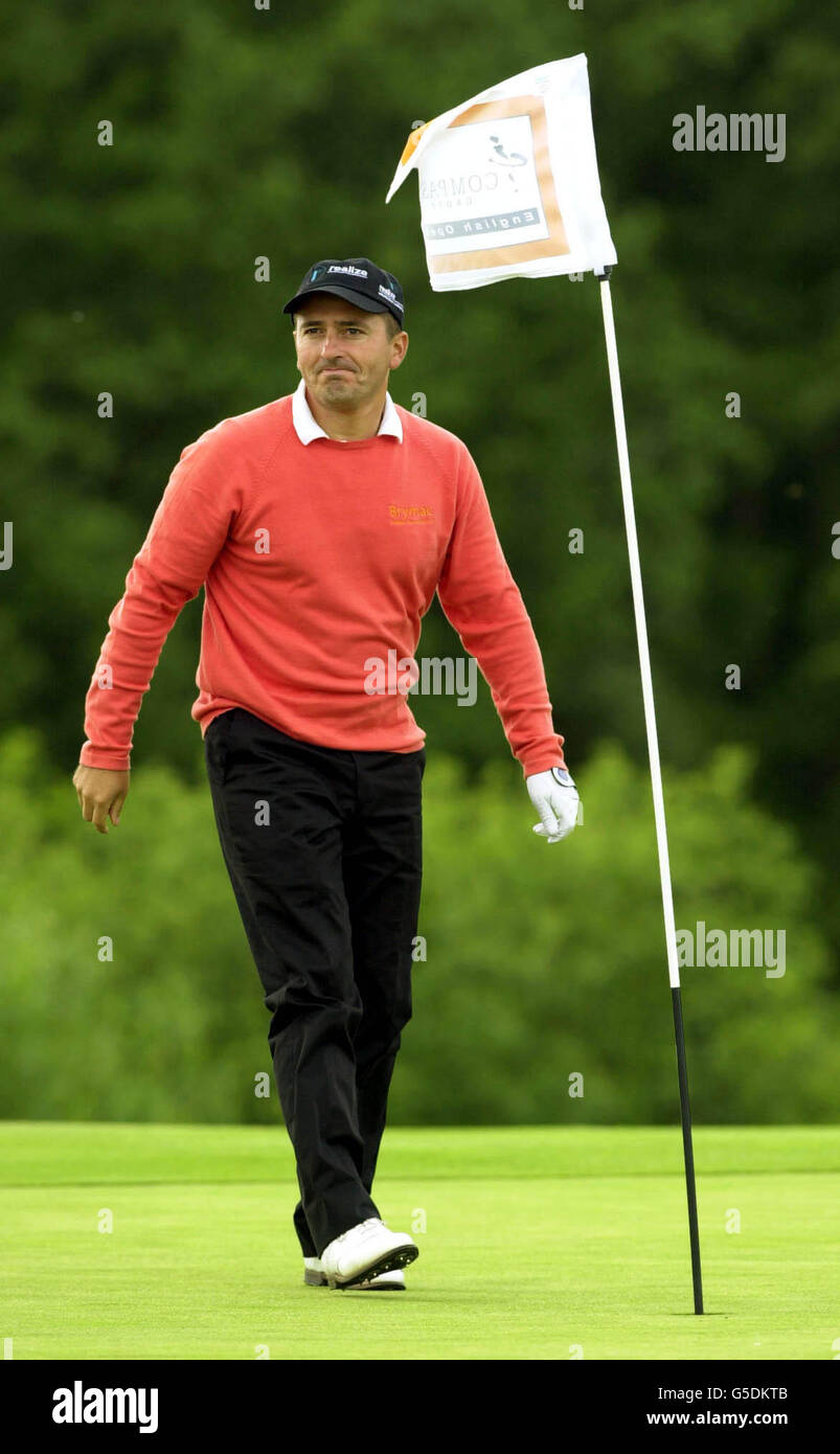 England's Van Phillips half smiles to the crowd after a hole in one at ...