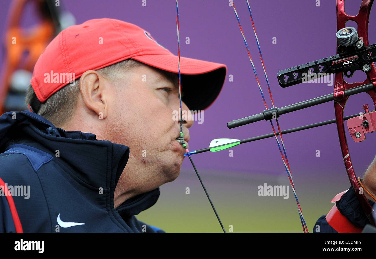 USA's Jeff Farby draws the bow with his teeth as he competes during the ...