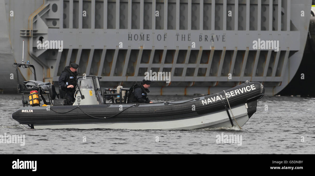 Irish Naval personnel provide security for the US Navy Ship USS Fort ...