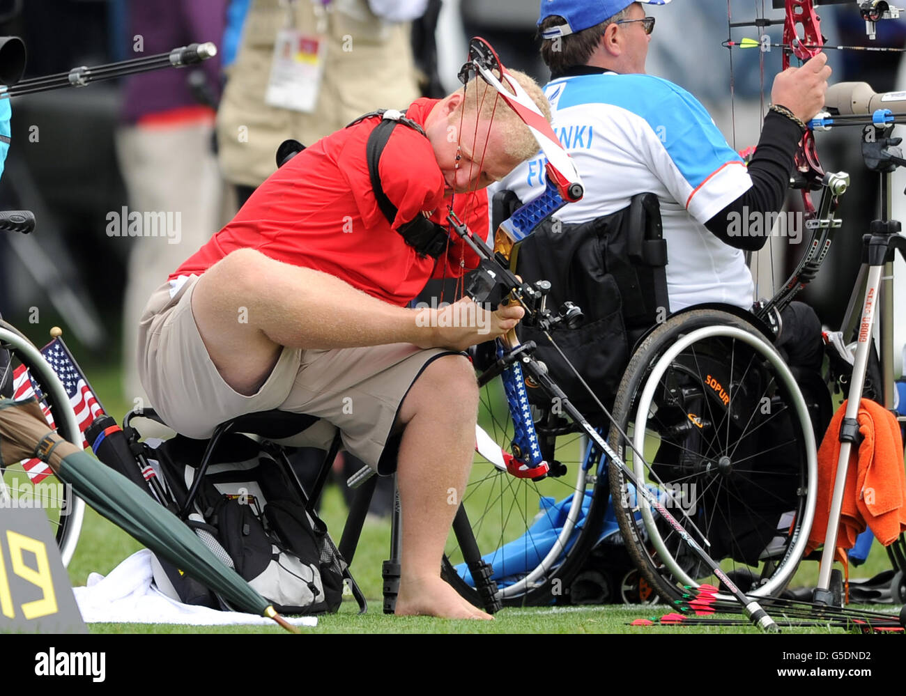 USA's Matt Stutzman holds the bow with his foot as he competes during ...