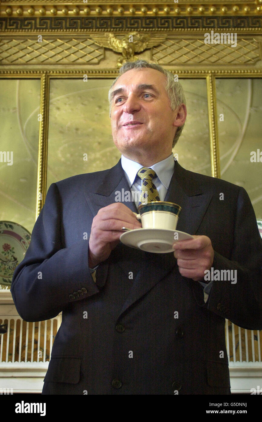 Taoiseach Bertie Ahern drinks a cup of tea while meeting with the ...