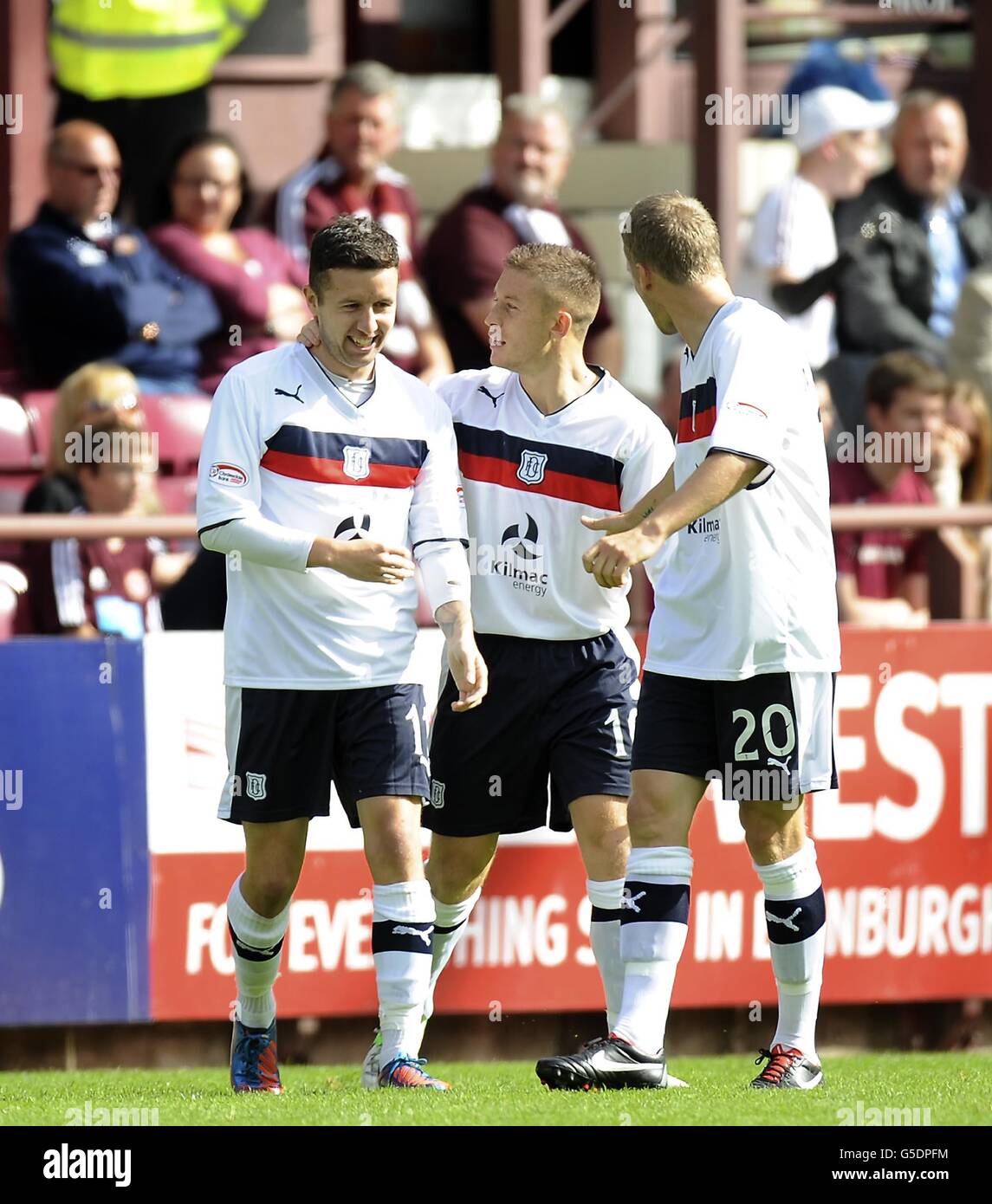 Dundee's Ryan Conroy celebrates with team mates after scoring from the ...