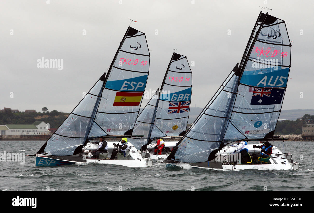 Skud fleet head upwind during Paralympic competition at the Sailing ...